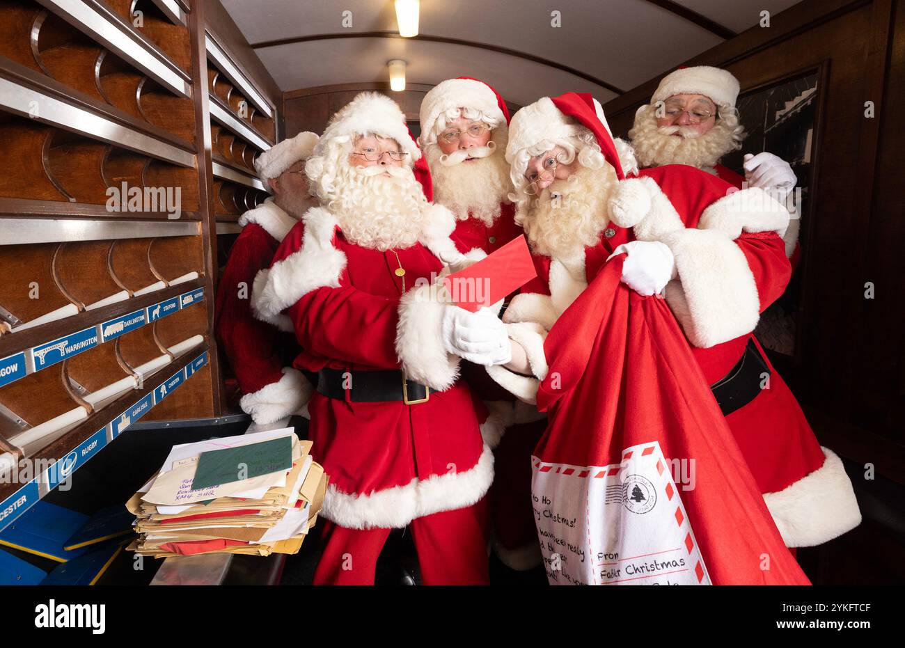 EDITORIAL USE ONLY Men dressed as Father Christmas performers take part ...