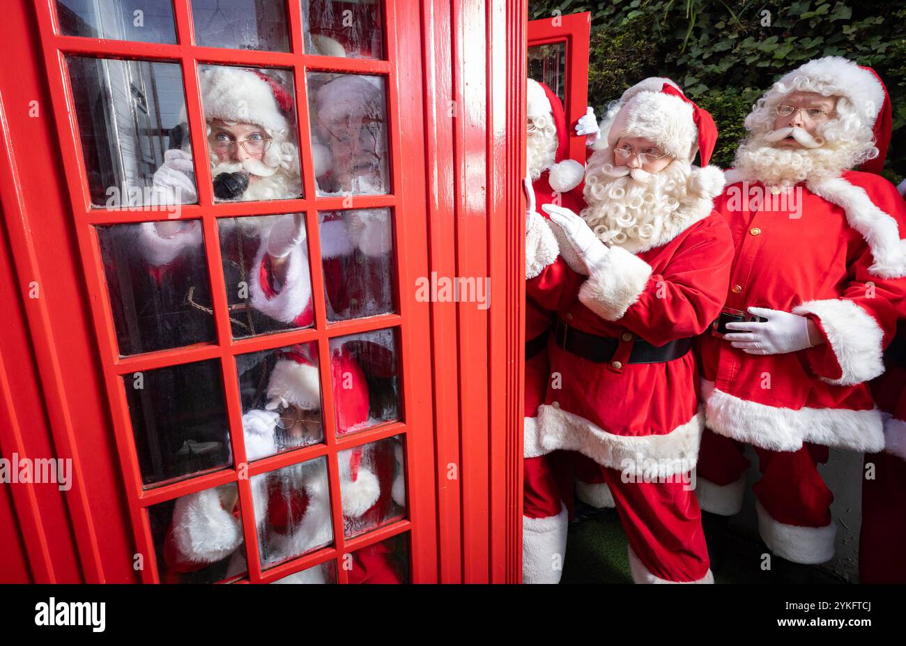 EDITORIAL USE ONLY Men dressed as Father Christmas performers take part ...