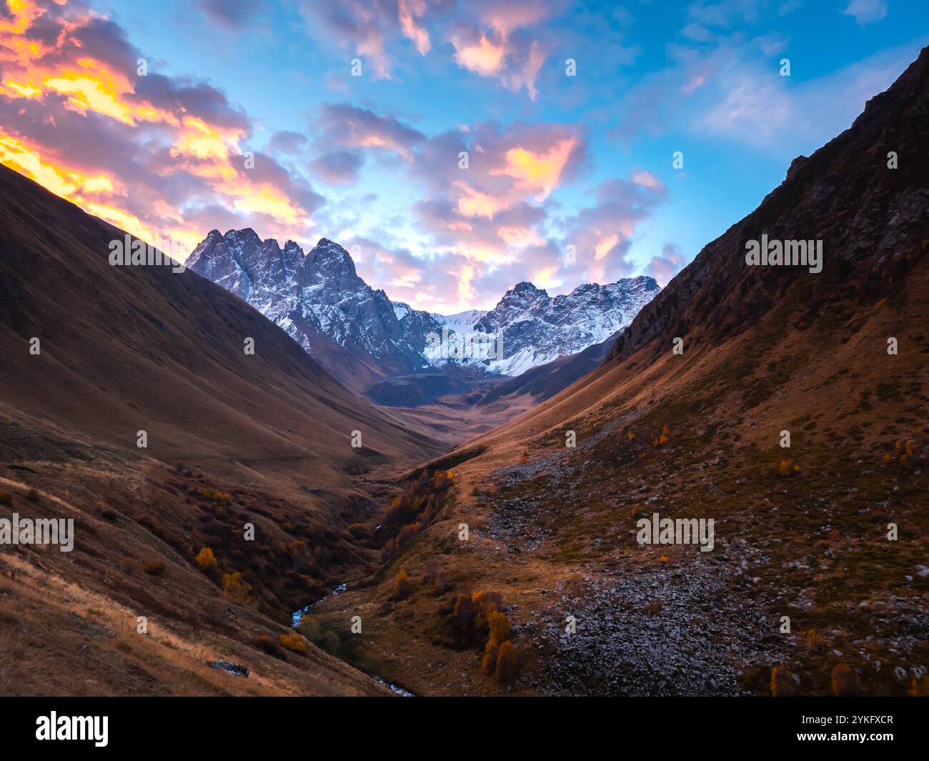 Autumn golden complex hills with amazing Caucasus mountains background ...