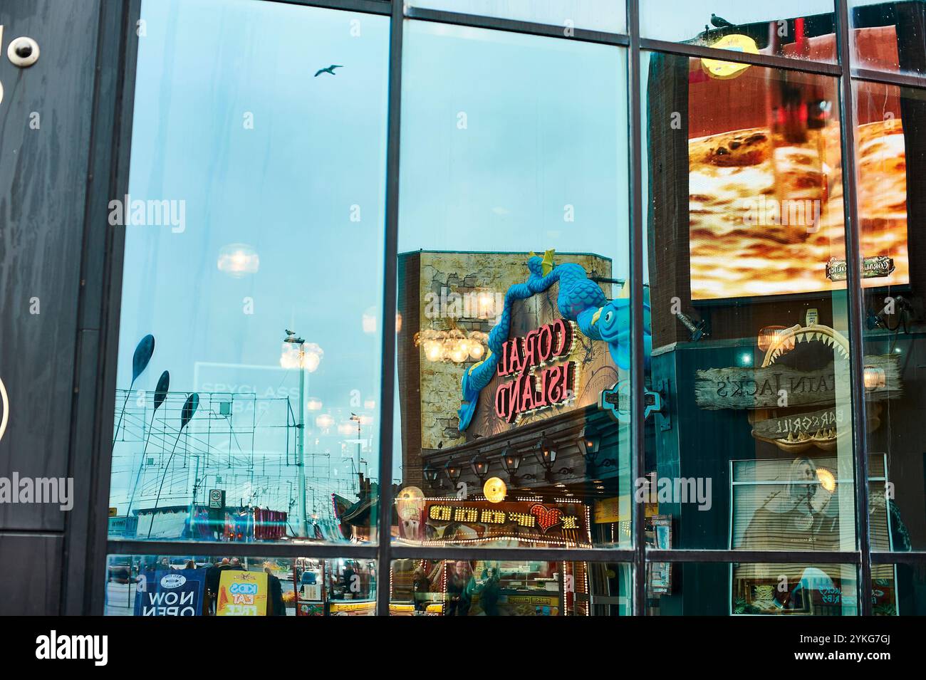 Coral Island amusement arcade and Blackpool Promenade reflected in ...