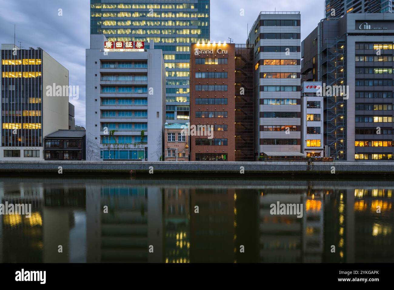 Evening view of riverside office buildings in the Kita Ward of Osaka ...