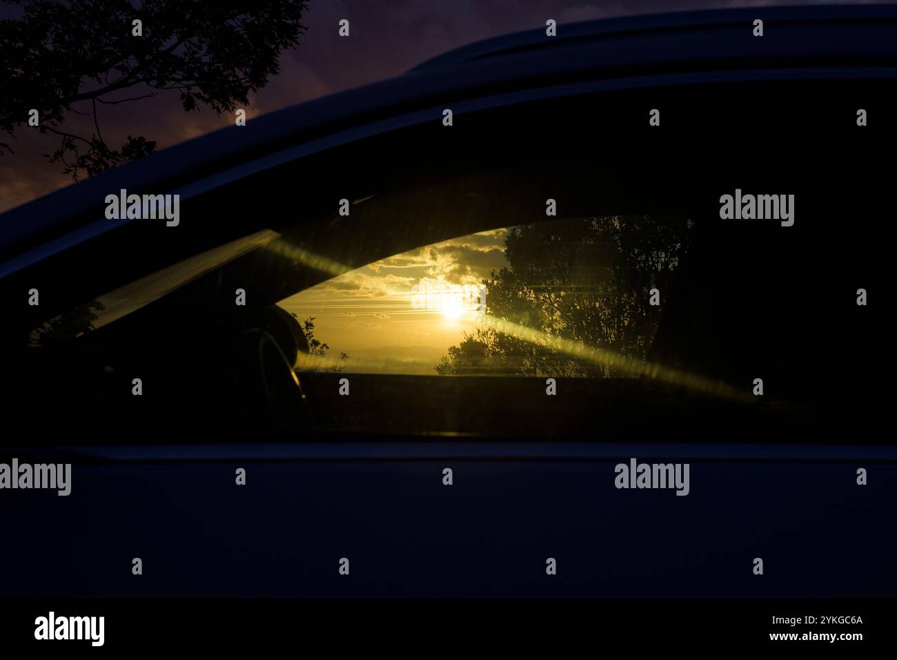 Sunset sun with glare through car window horizontally Stock Photo - Alamy