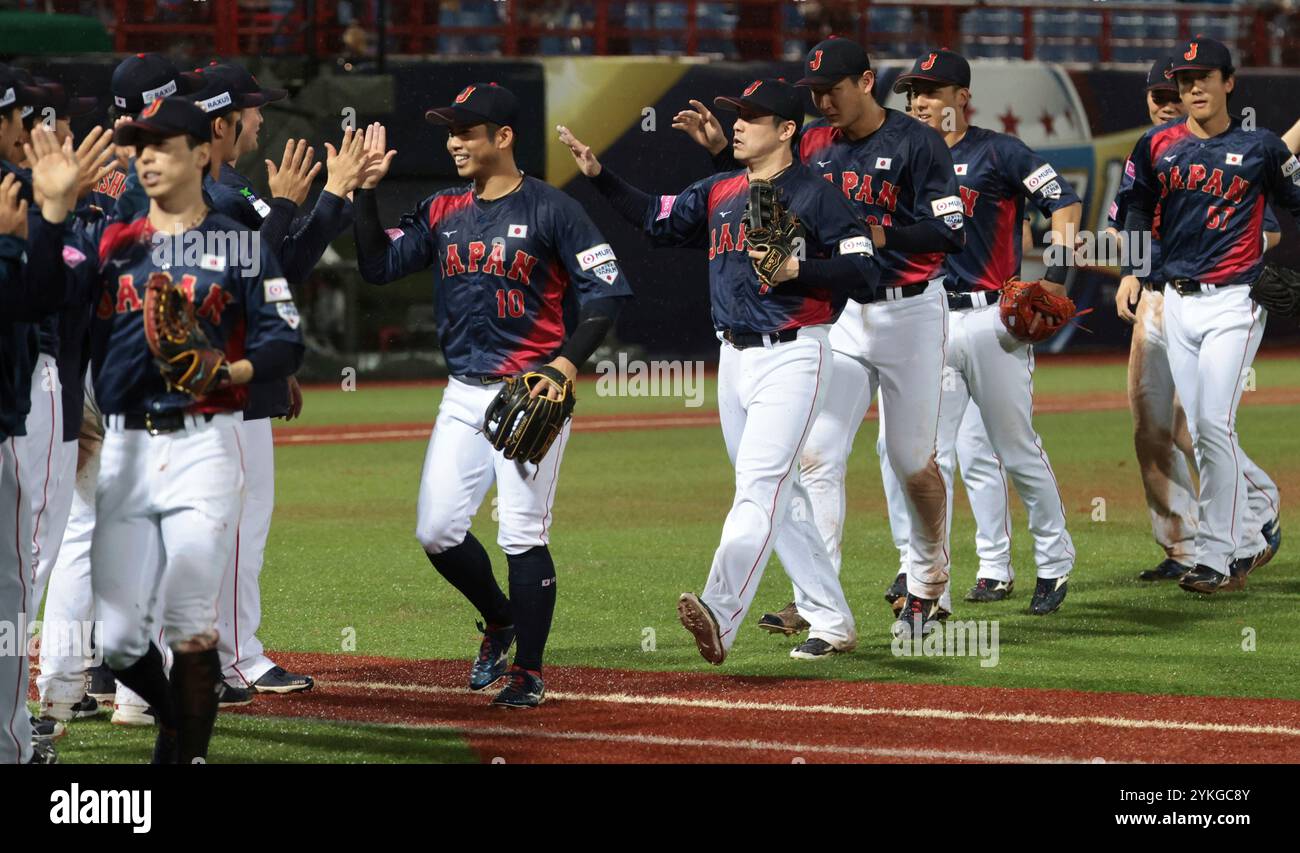 Members of Japan celebrate after winning the WBSC Premier12 Group B ...