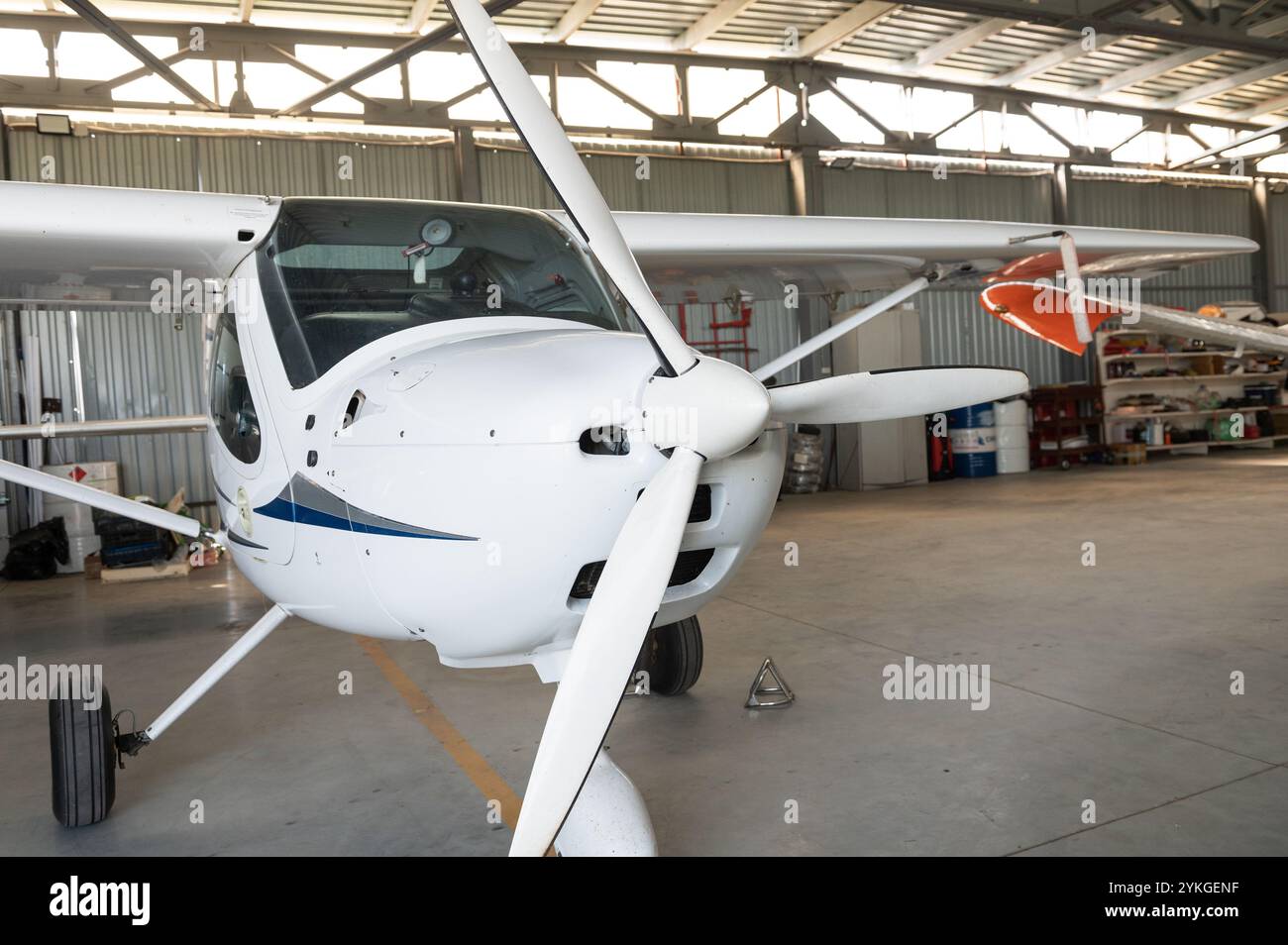 Small private lightweight propeller airplane in hangar, closeup photo ...