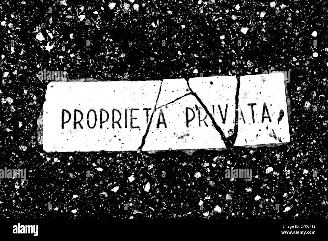 stone plaque set on the asphalt pavement with the inscription Private ...