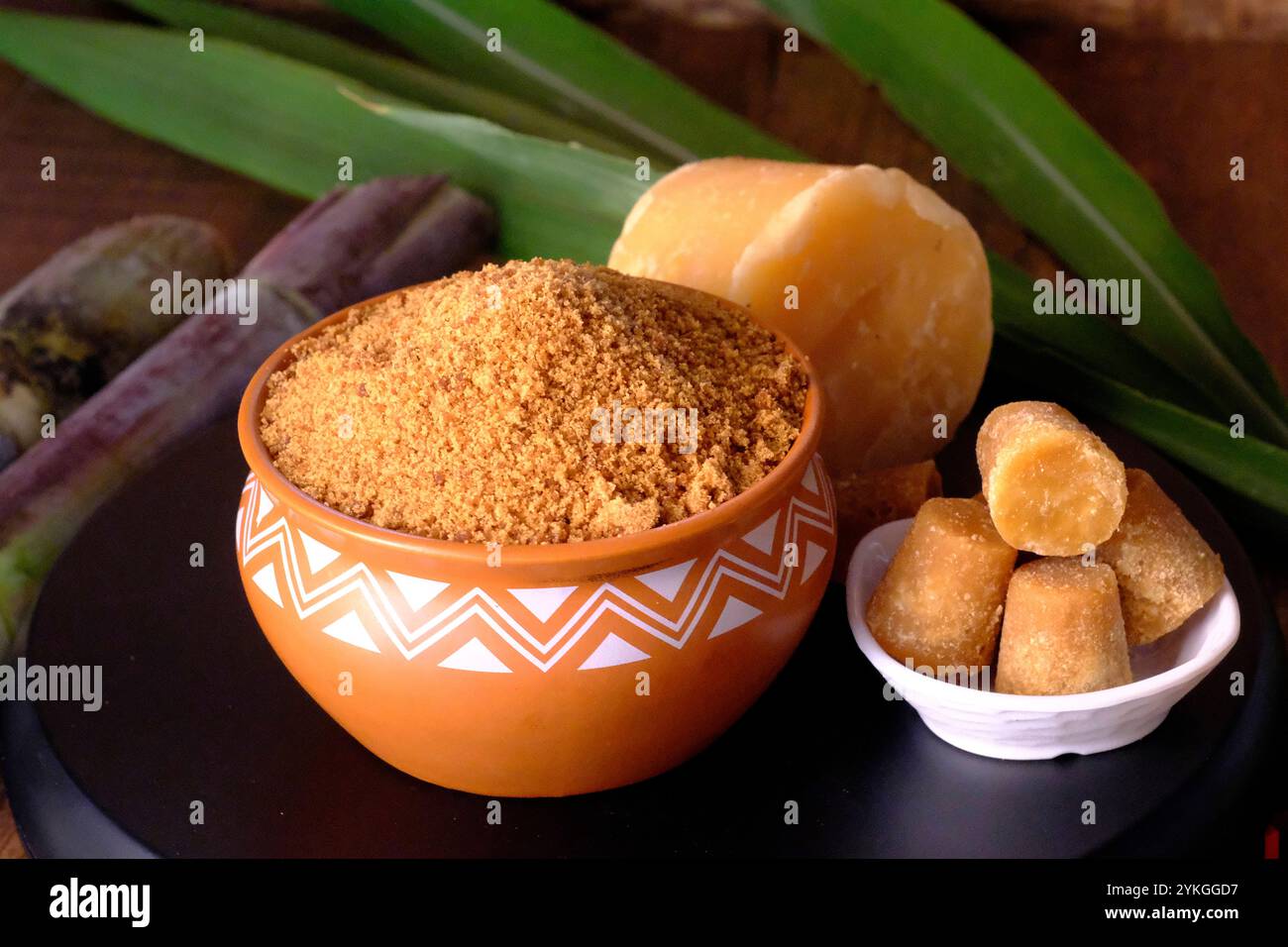 Jaggery powder with jaggery cubes. Jaggery is used as an ingredient in ...