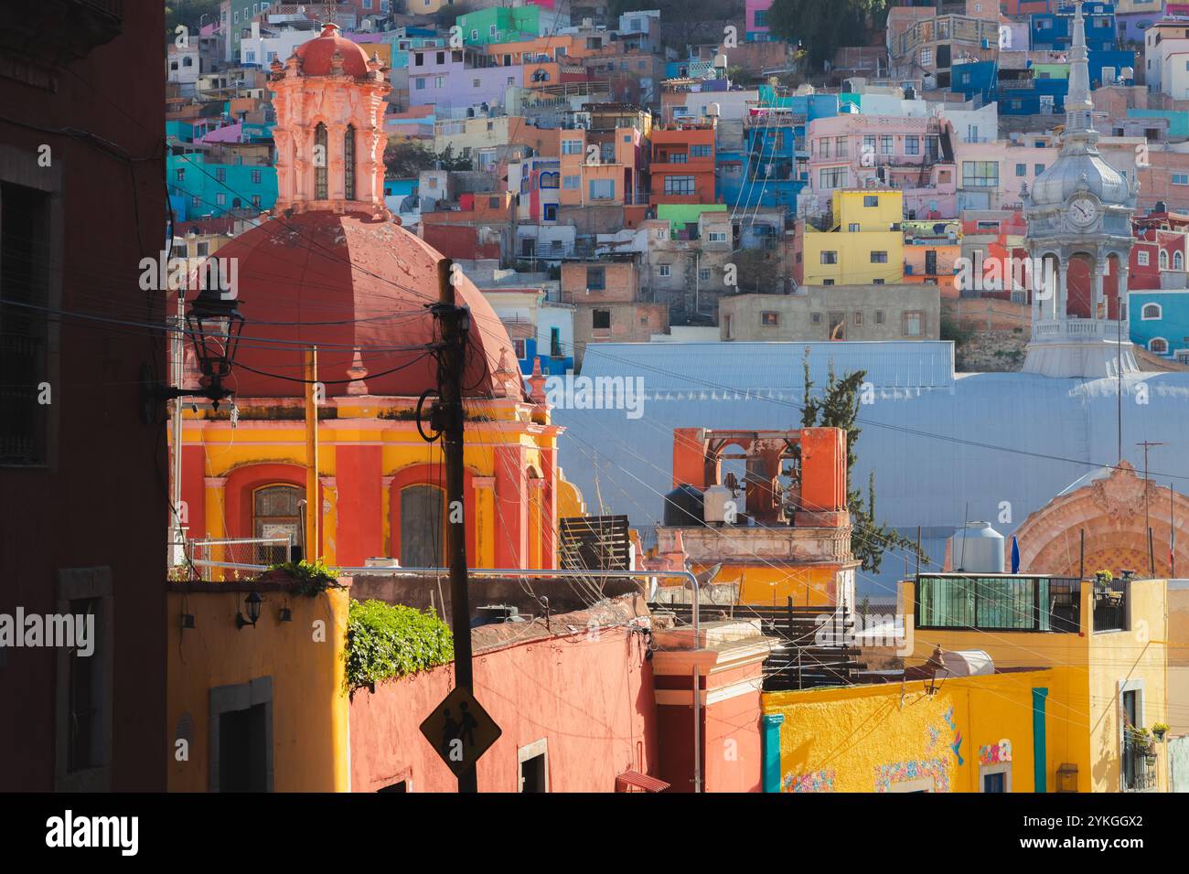 A vibrant view of the historic dome of Guanajuato Basilica and densely ...
