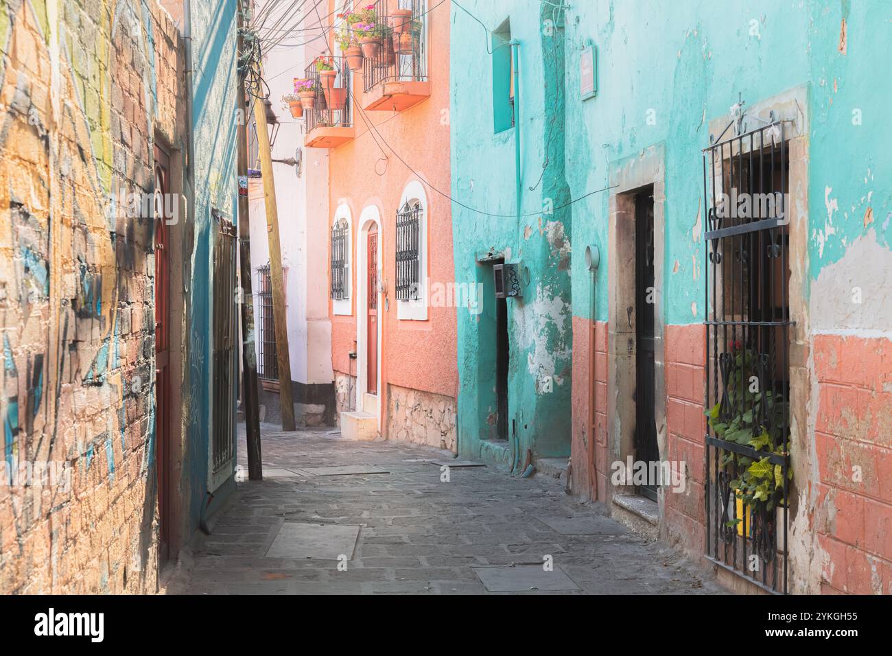 A colourful alleyway in Guanajuato, Mexico, lined with pastel-painted ...