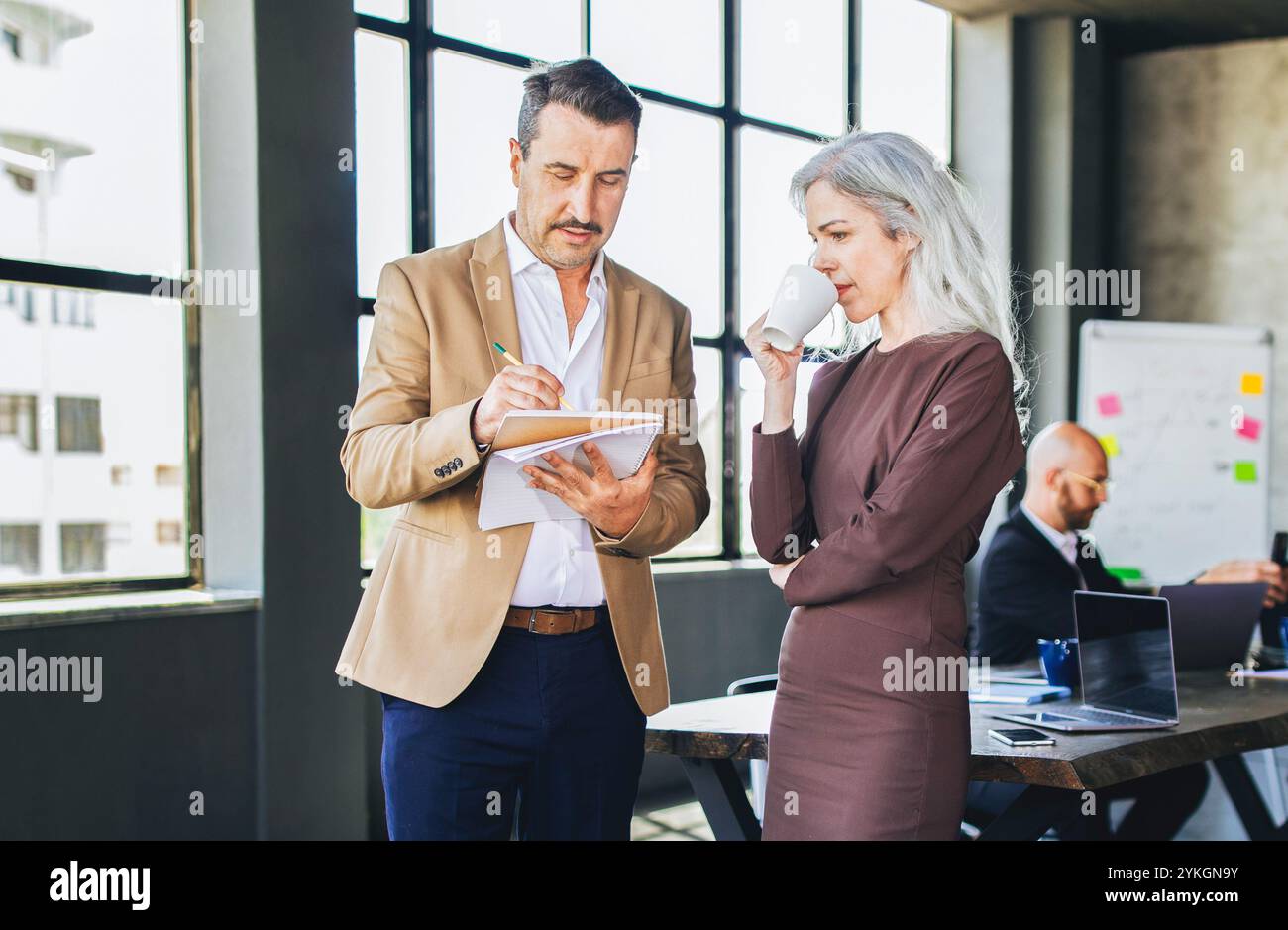 Professionals brainstorming in a modern office meeting Stock Photo - Alamy