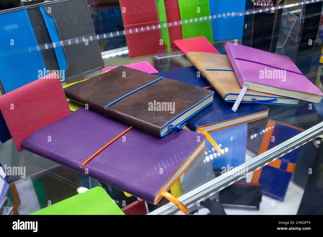 Multi-colored notepads on the counter of a stationery store. Products ...