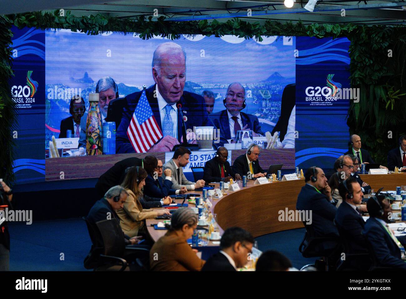 President Joe Biden, pictured on screen, speaks as other G20 leaders ...