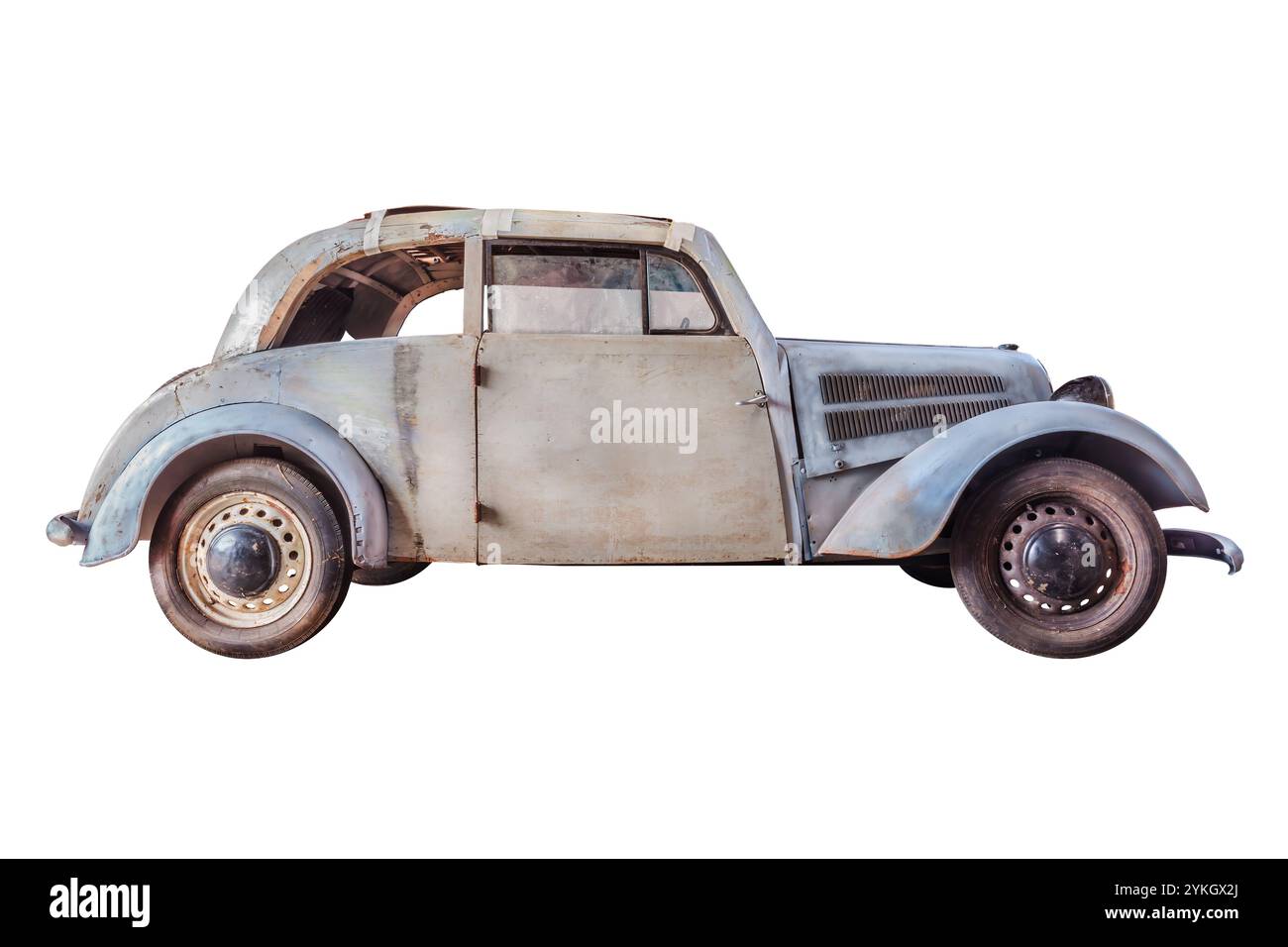 Barnfind of a wrecked oldtimer car with broken wooden parts isolated on ...