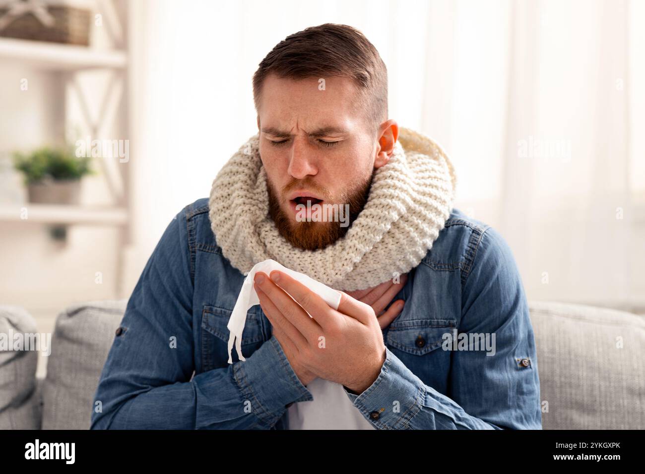 Sick guy coughing hardly at home alone Stock Photo - Alamy