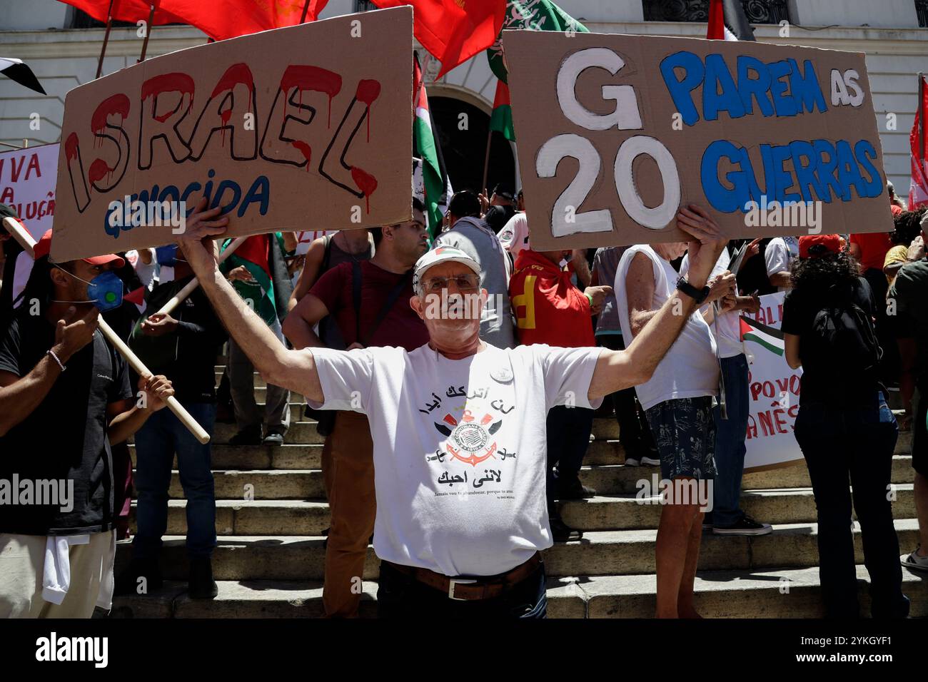 A demonstrator holds a sign that reads in Portuguese "Israel, genocide ...
