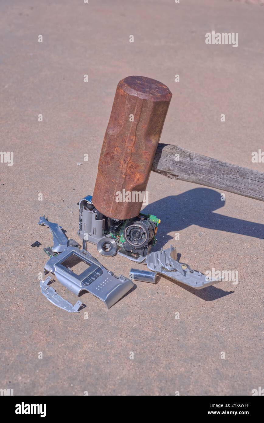 A sledge hammer smashing and destroying a 22 year old Point and Shoot ...