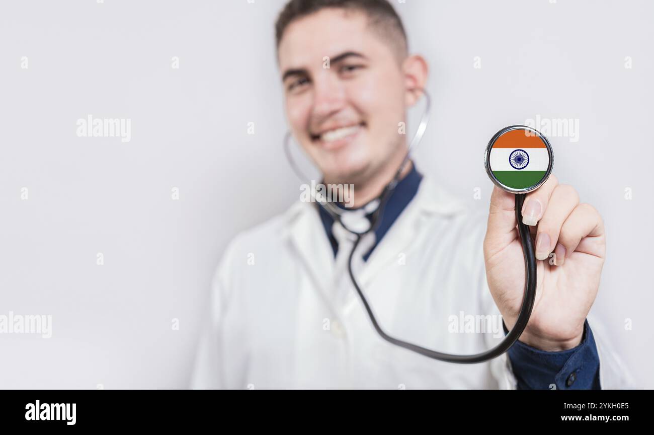 Smiling doctor showing stethoscope with India flag. India National ...