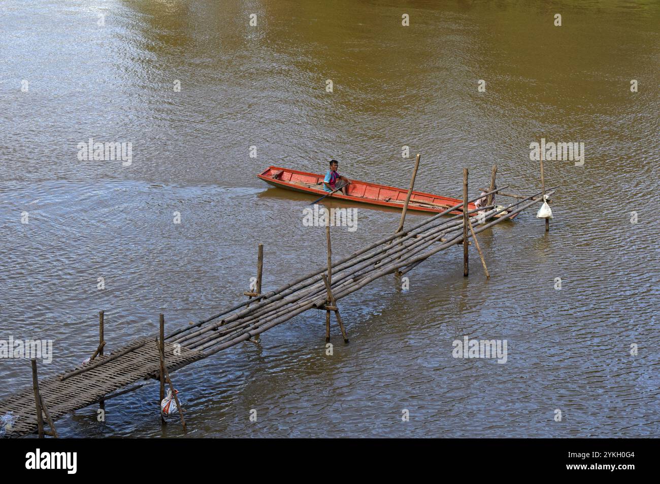 Red boat on a bamboo jetty on the Mekong, Luang Prabang, Laos, Asia ...