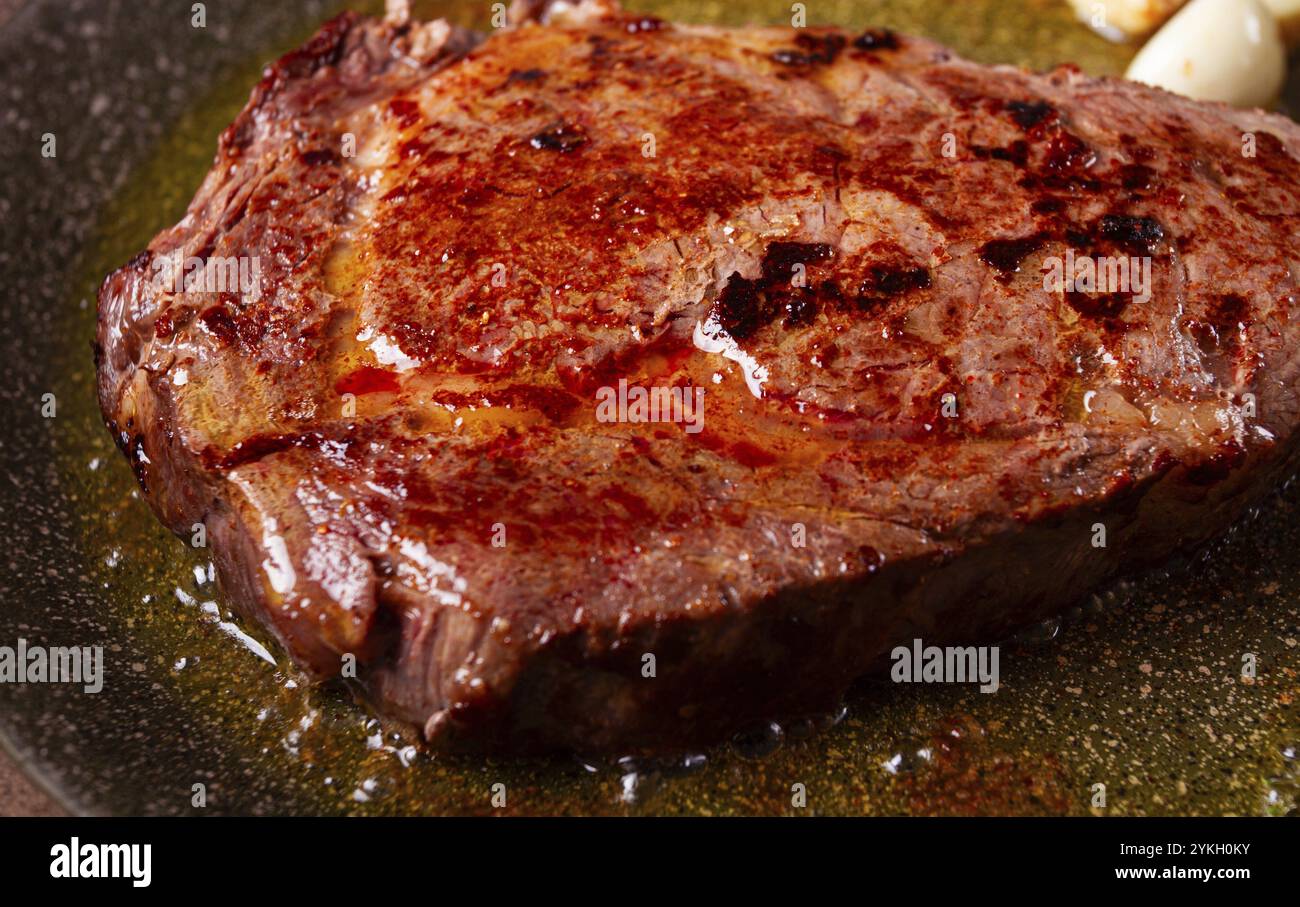 Fried steak, beef steak, rib eye steak, in a frying pan, top view, no ...
