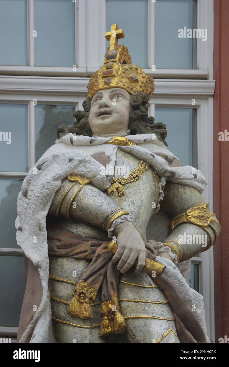 Sculpture of a Roman emperor with golden crown and cross, golden, view ...
