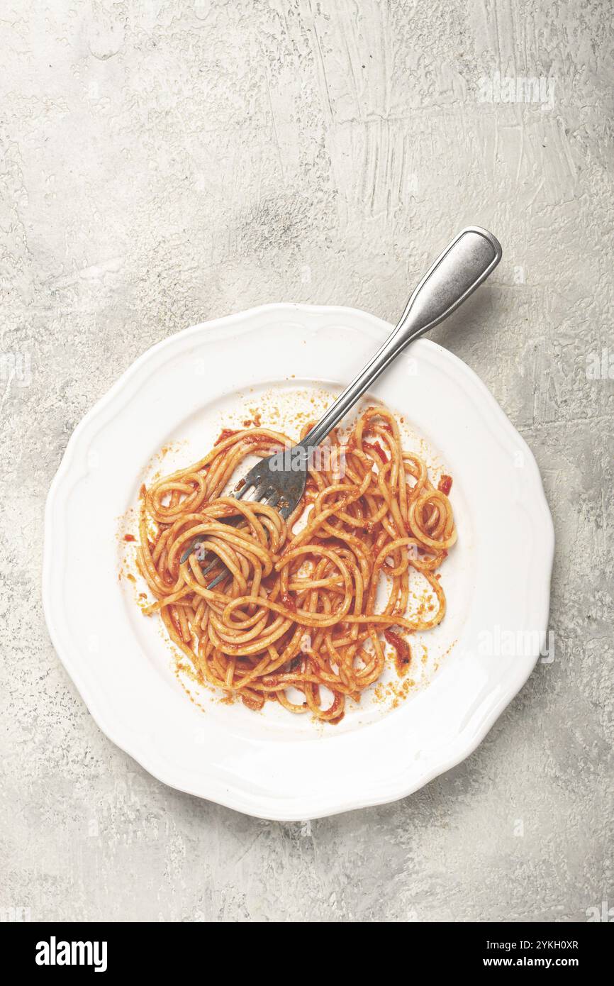 A plate with leftover spaghetti bolognese, no people Stock Photo - Alamy