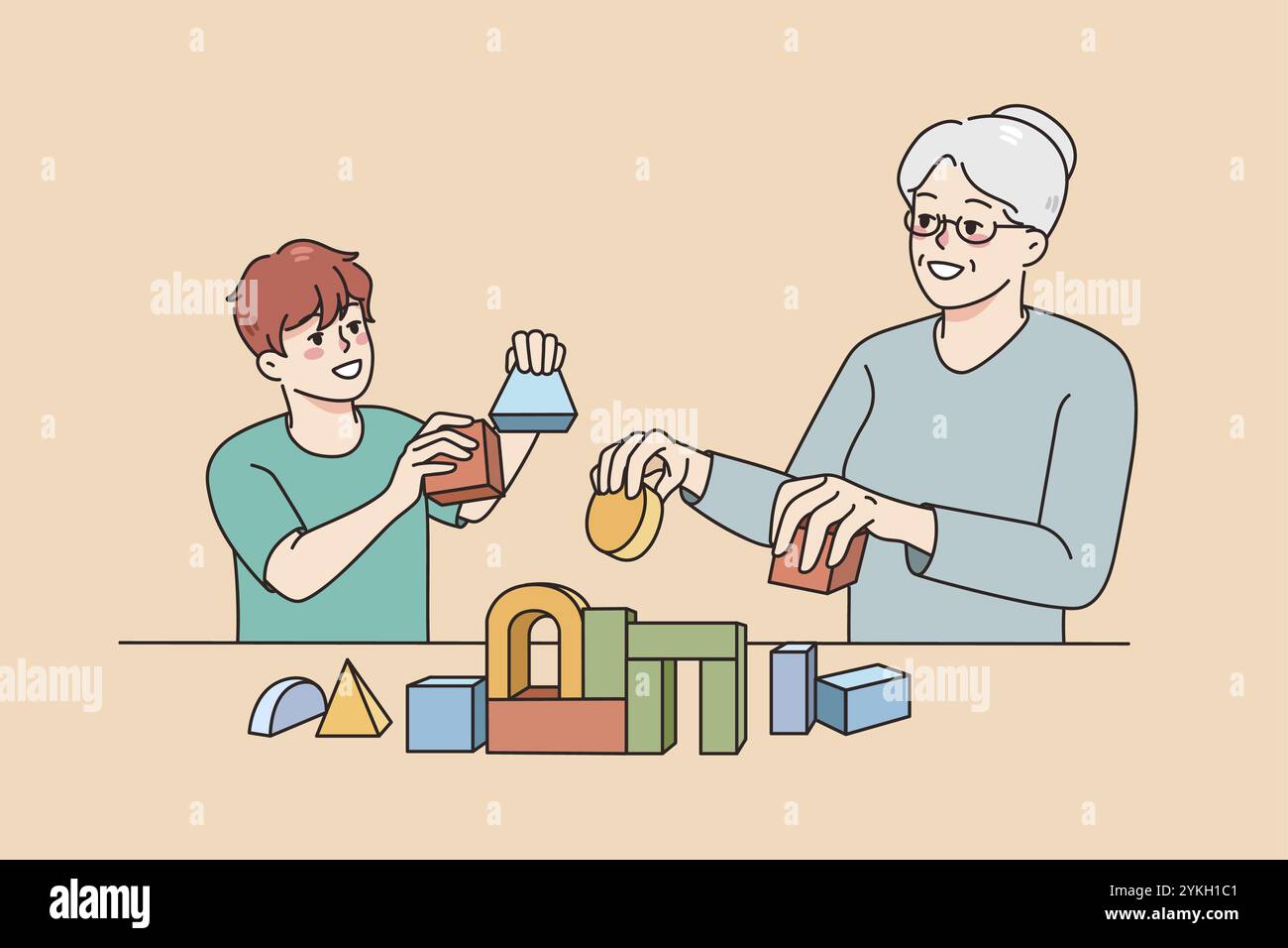 Loving elderly grey-haired grandmother play toys with small grandchild ...