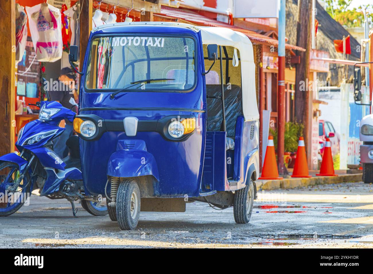 Blue auto rickshaw tuk tuk in beautiful Chiquila village port harbor ...