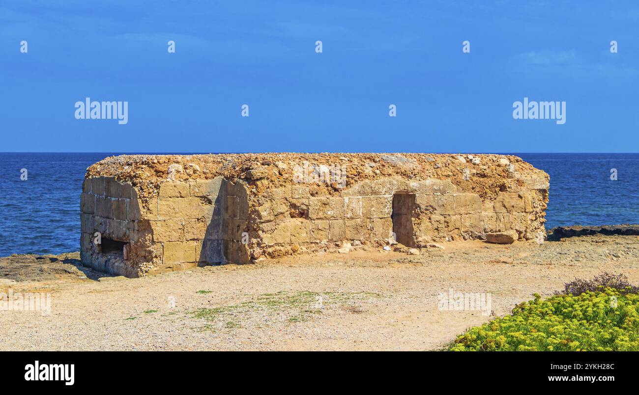 Stone sculptures and ruins in rough natural coastal and beach landscape ...