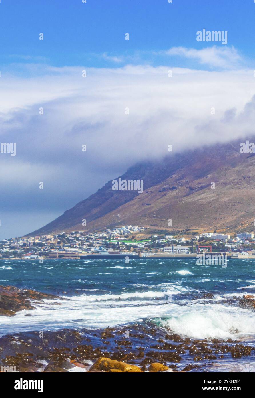 False Bay rough coast landscape with boulders waves and mountains with ...