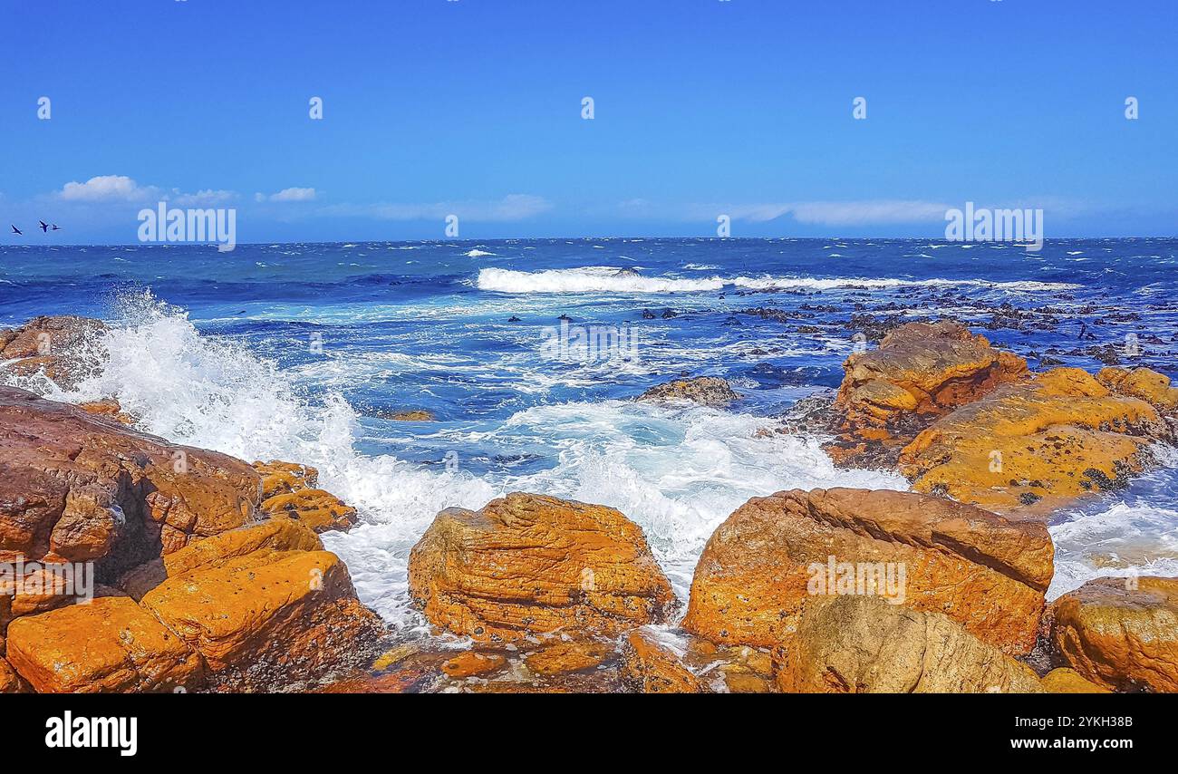 False Bay rough coast landscape with boulders waves and mountains with ...