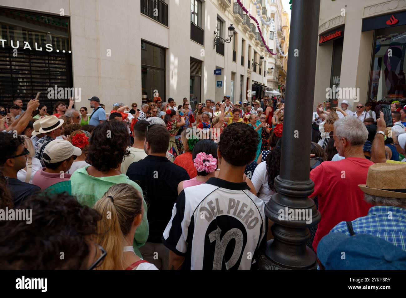 A lively crowd gathers during the August Fair, celebrating with music ...