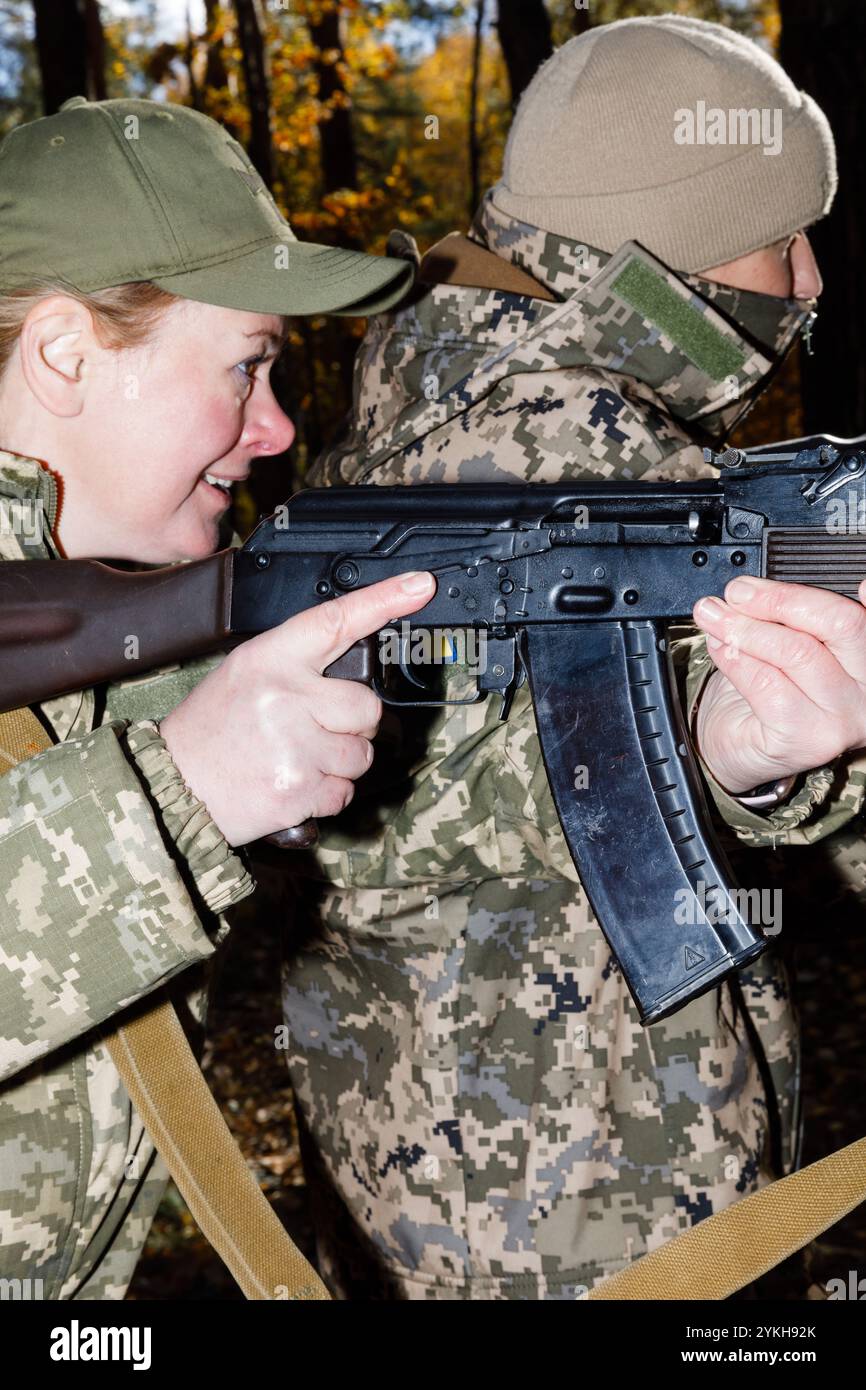 A woman is seen carrying a weapon during a tactical exercise during a ...