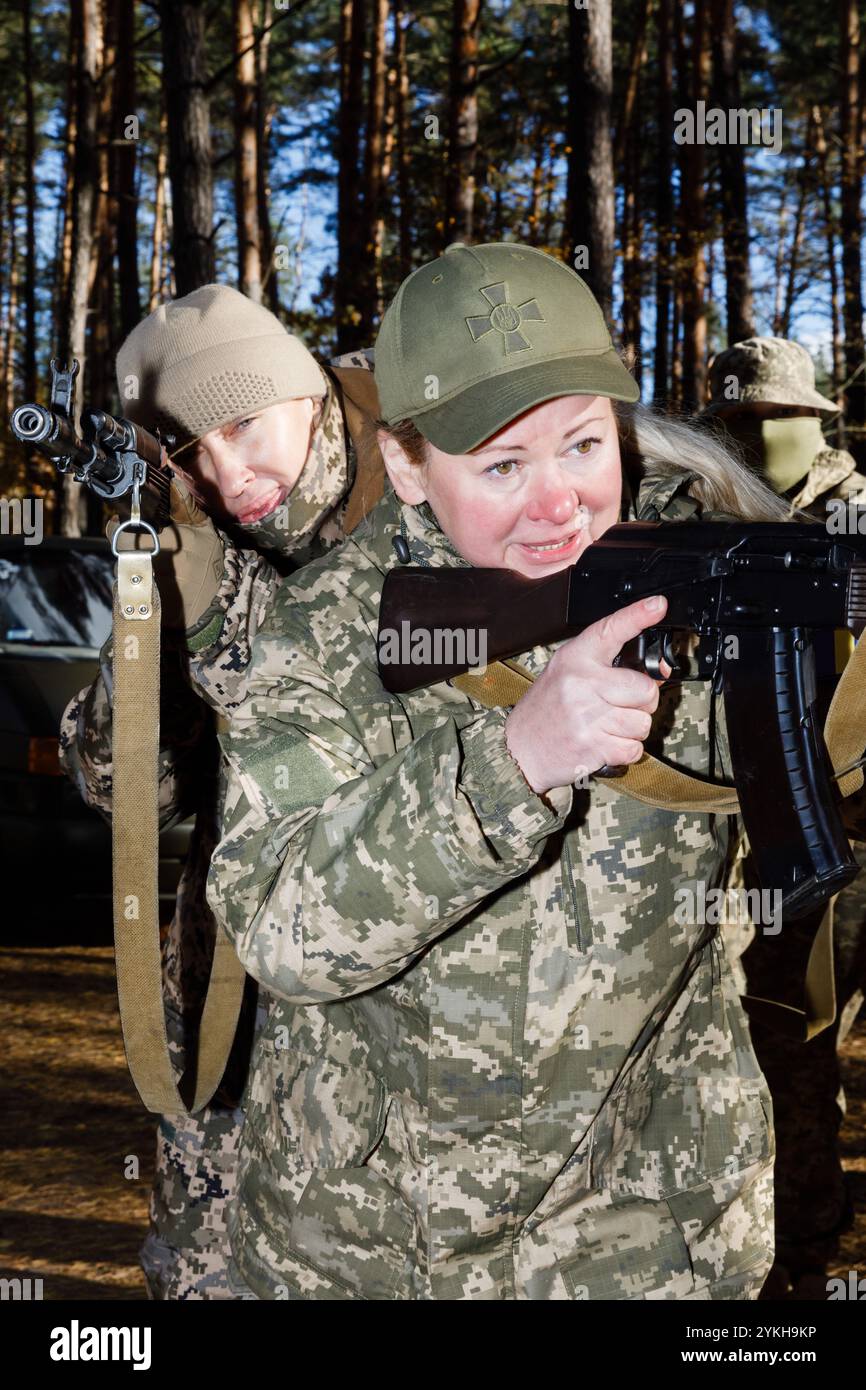 A woman is seen carrying a weapon during a tactical exercise during a ...
