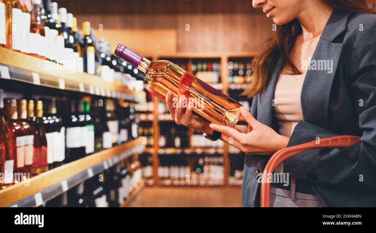 Closeup photo of rose wine in female customer of wine shop Stock Photo ...