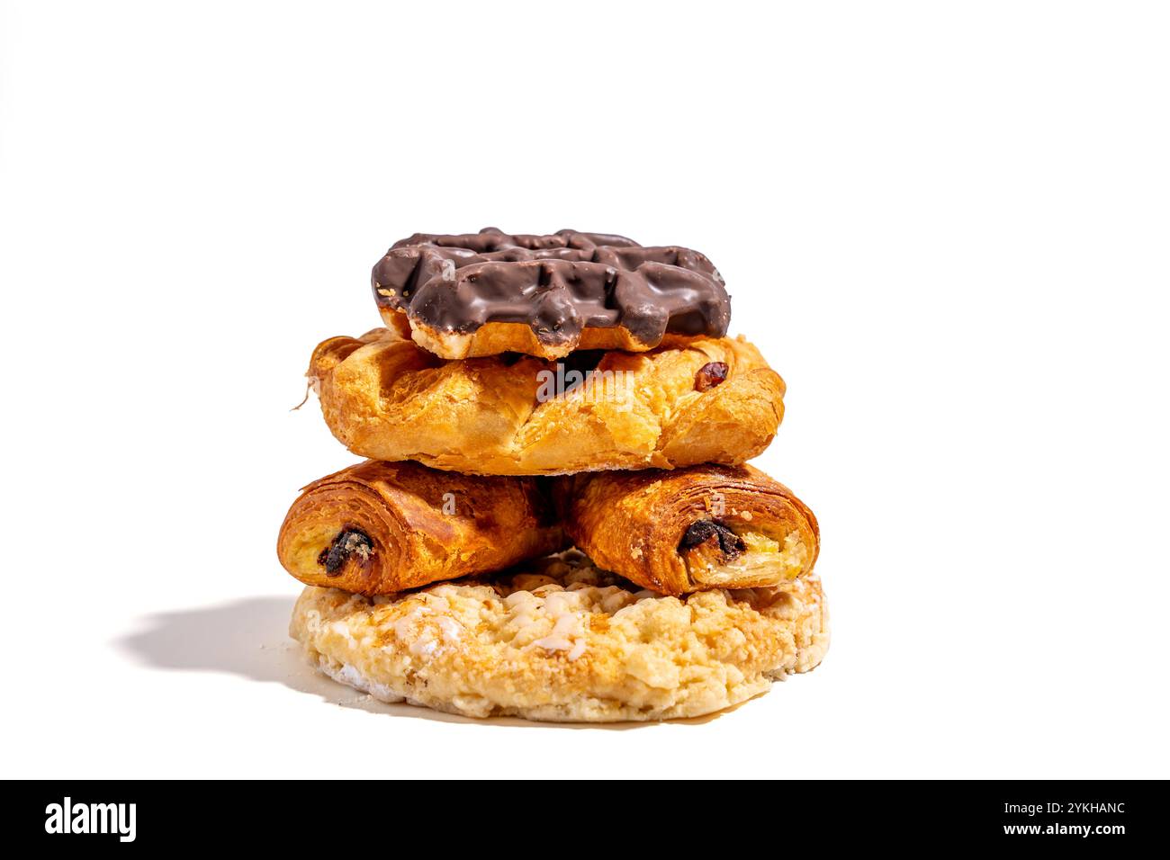 A stack of pastries with a chocolate topping. The pastries are arranged ...