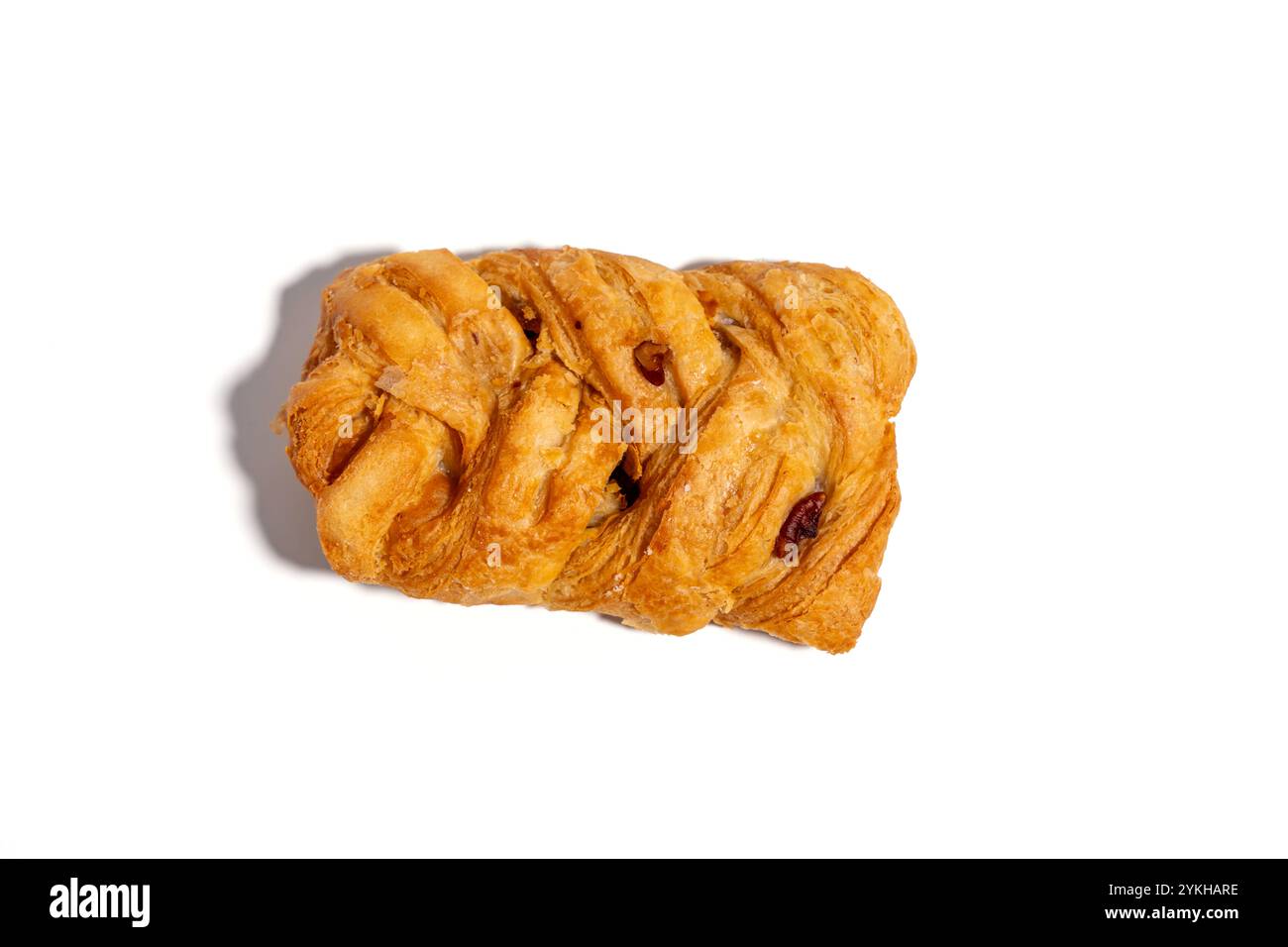 A pastry with a spiral design and a sprinkle on top. The pastry is ...