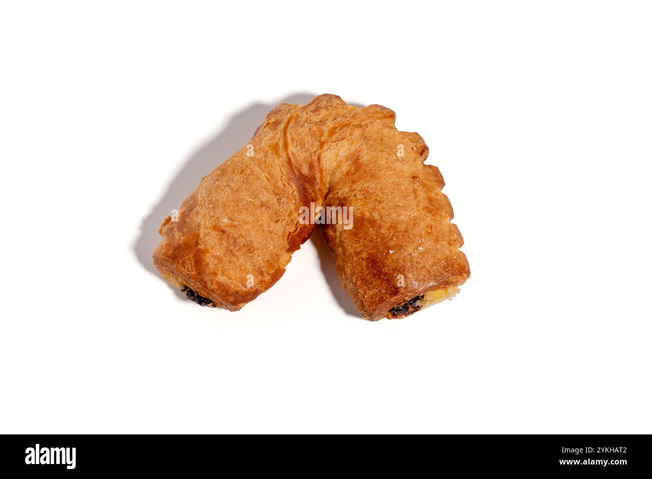 Pastries lie on a white background. The pastry is brown and has a sweet ...