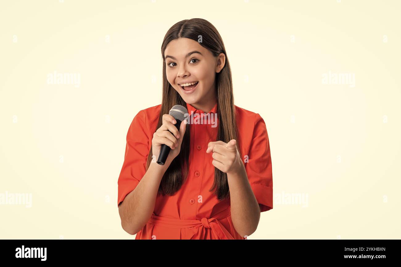 teen girl singer holding microphone point finger in studio. teen girl ...