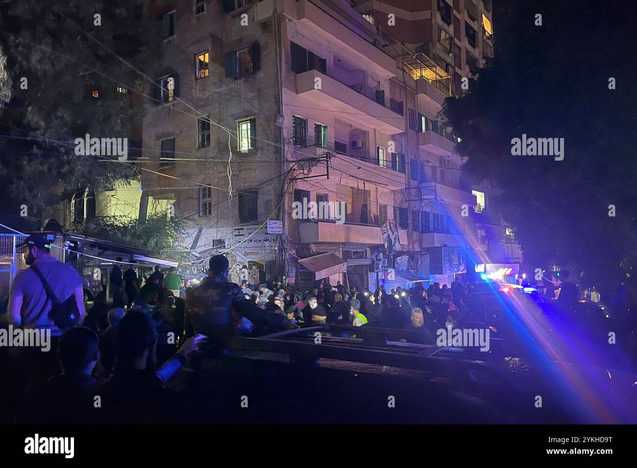 Residents and rescuers gather at the site of an Israeli airstrike in ... Residents and rescuers gather at the site of an Israeli airstrike in ...