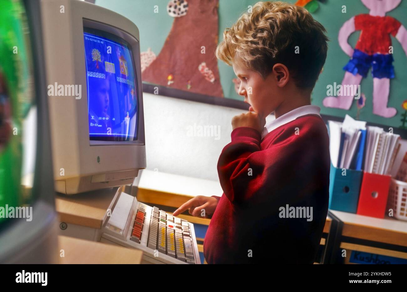 Infant school boy in 1990s computer class room hi-res stock photography ...