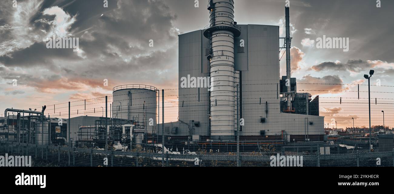 Industrial power plant with dramatic sunset sky Stock Photo - Alamy