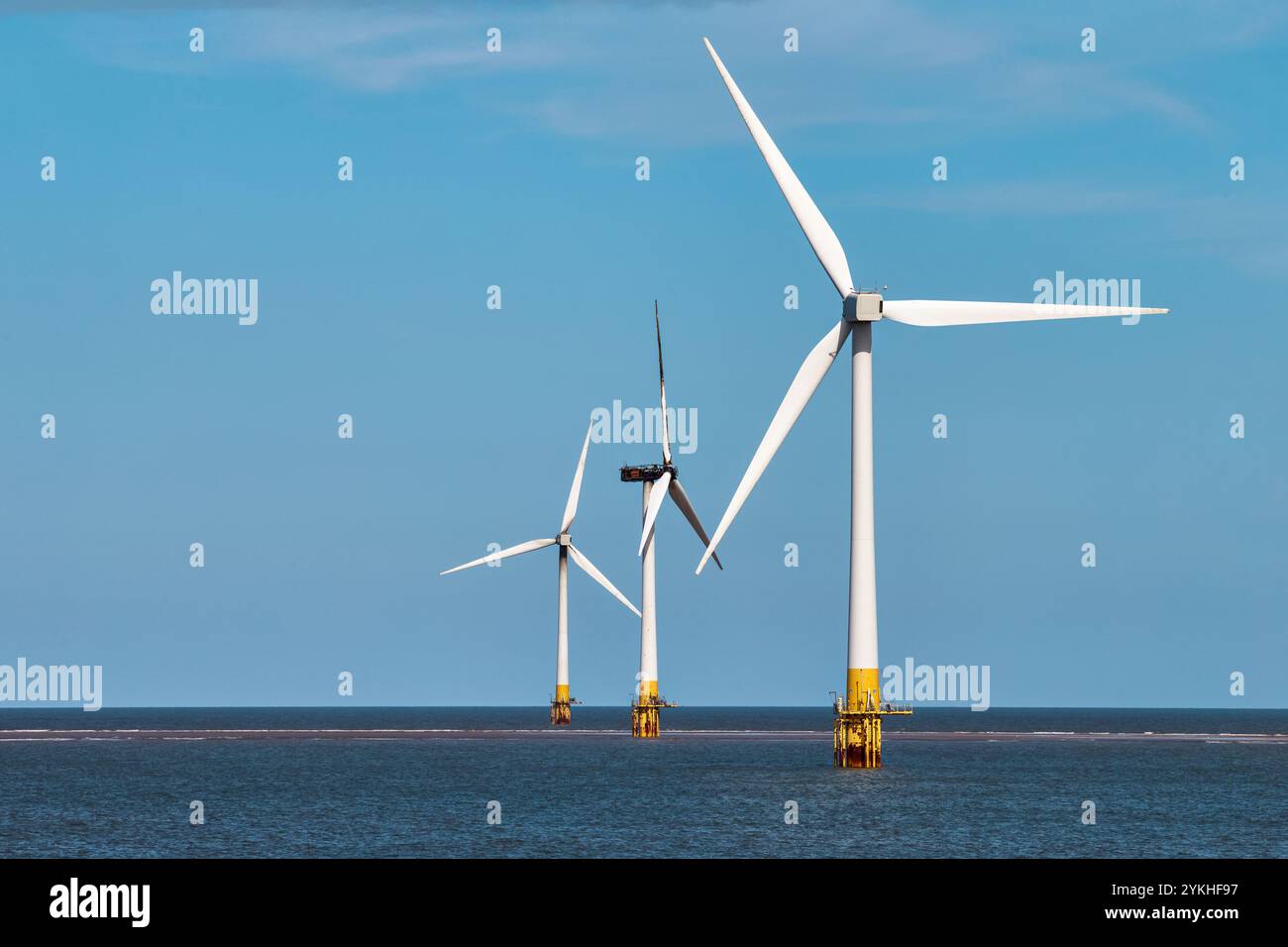 Offshore wind turbines standing in the sea. Wind turbine generator ...