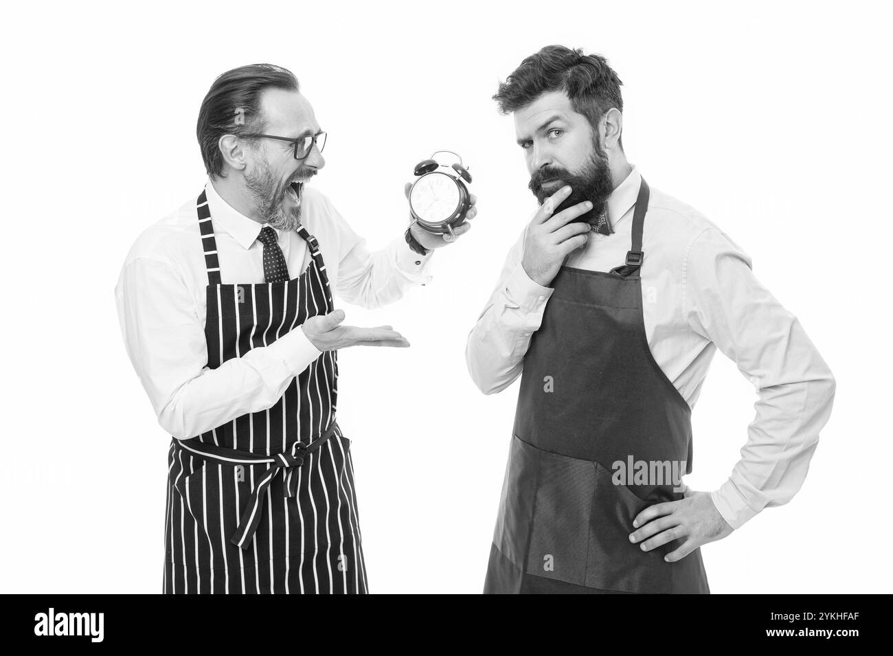 It is lunch time. Men cooks with alarm clock. Man bearded hipster and ...
