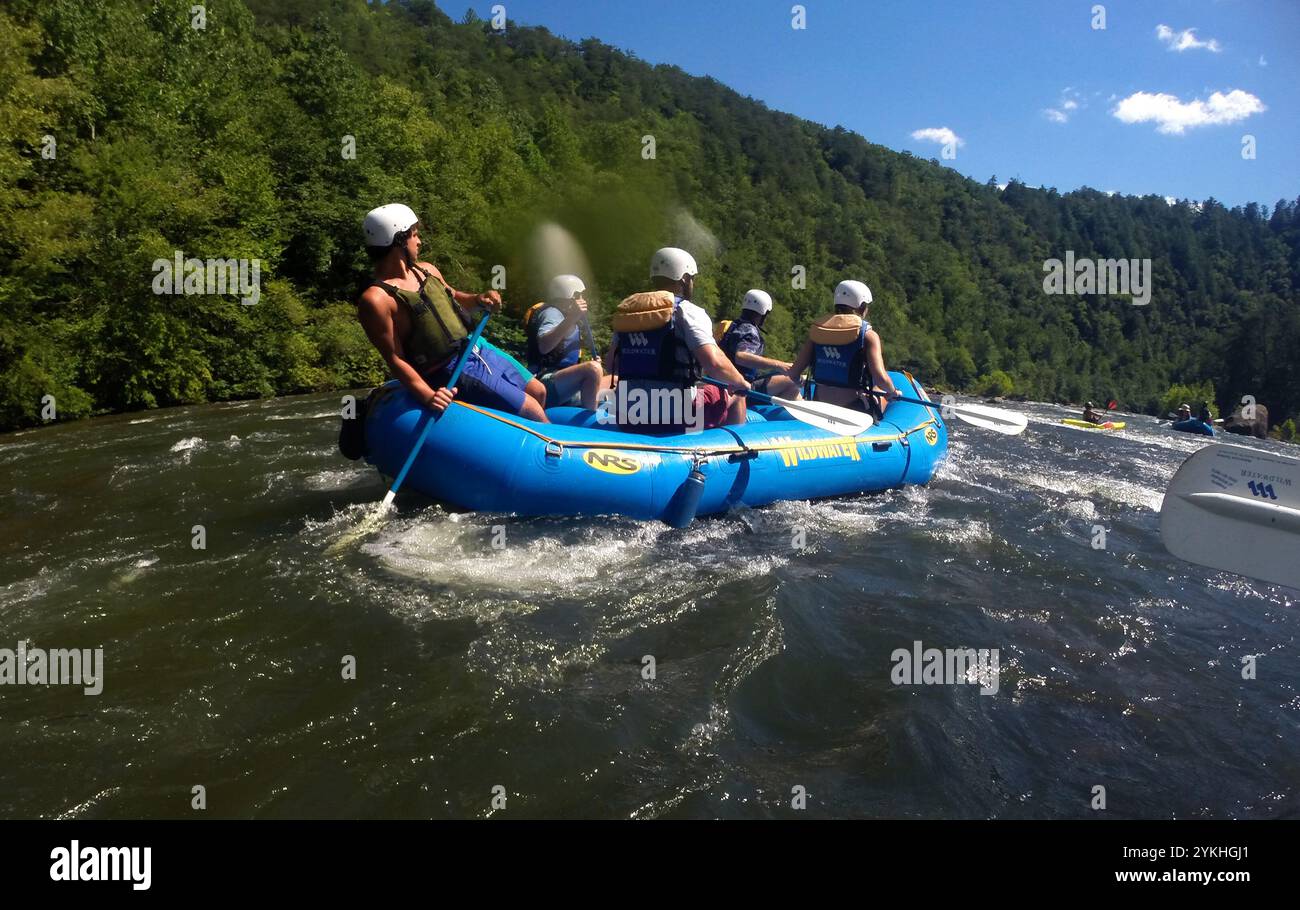 Patrons hit the rapids while whitewater rafting through the Ocoee River ...