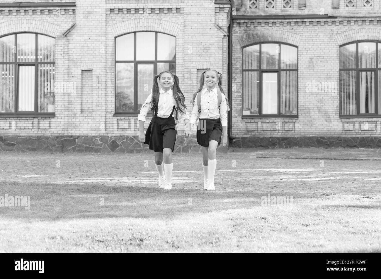 Two girls kids in Black and White Stock Photos & Images - Alamy