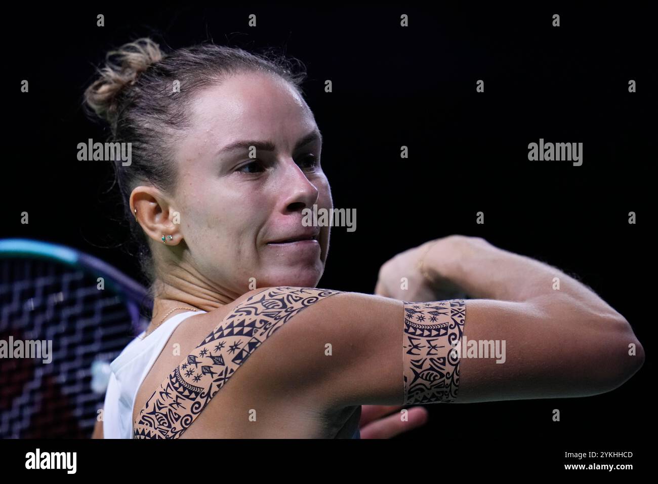 Poland's Magda Linette returns the ball to Italy's Lucia Bronzetti ...