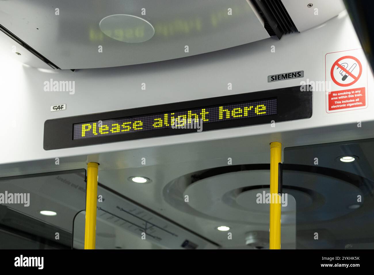 Please alight here sign on train - England, UK Stock Photo - Alamy