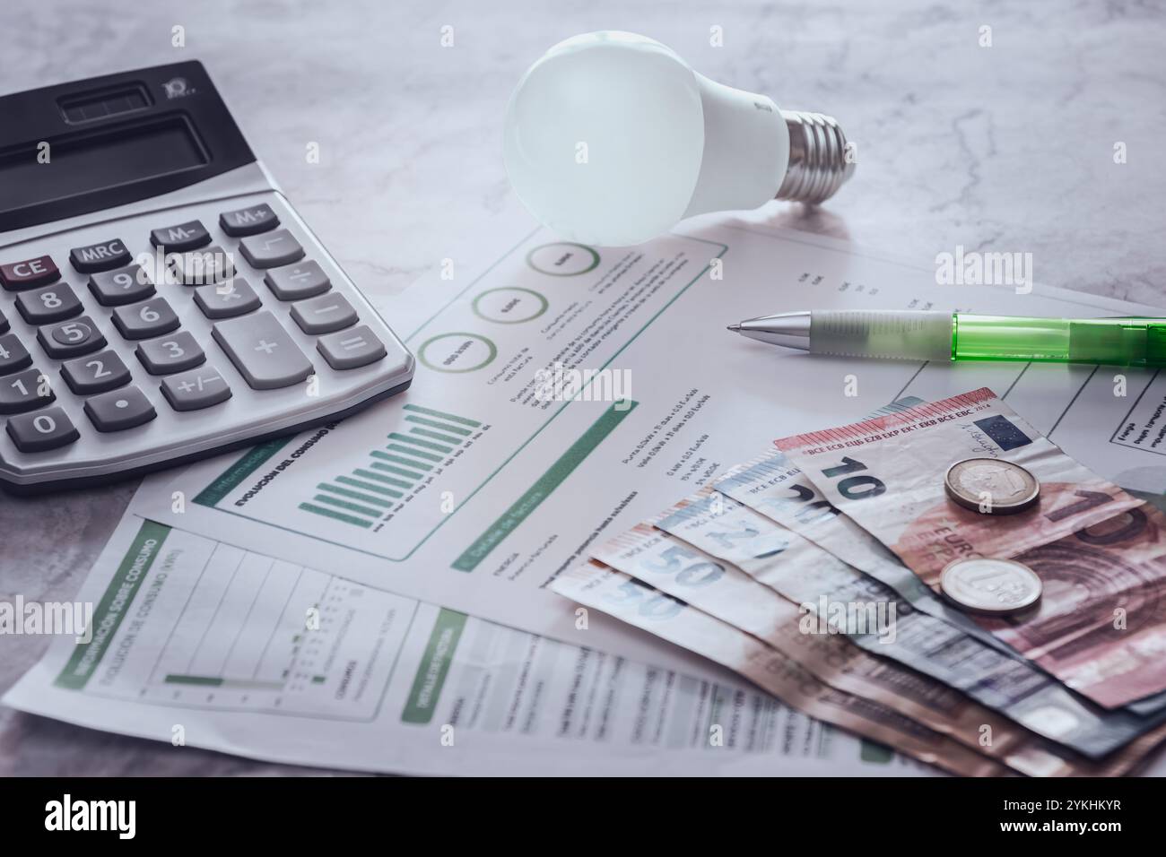 Electric light bulb and expense bill Stock Photo - Alamy