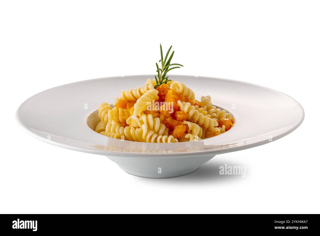 Pasta fusilli seasoned with pumpkin sauce with rosemary sprig in white ...