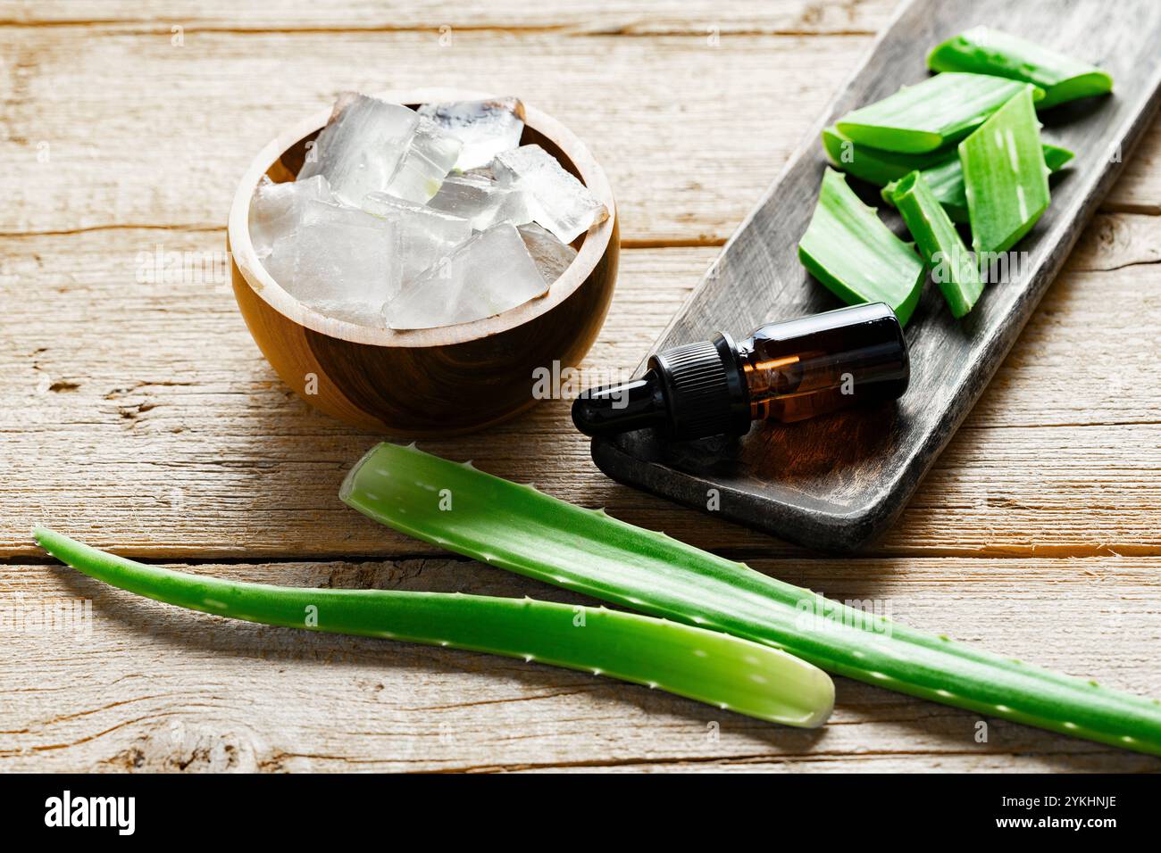 Aloe Vera leaves, pulp in small pieces and aloe extract are seen in a ...