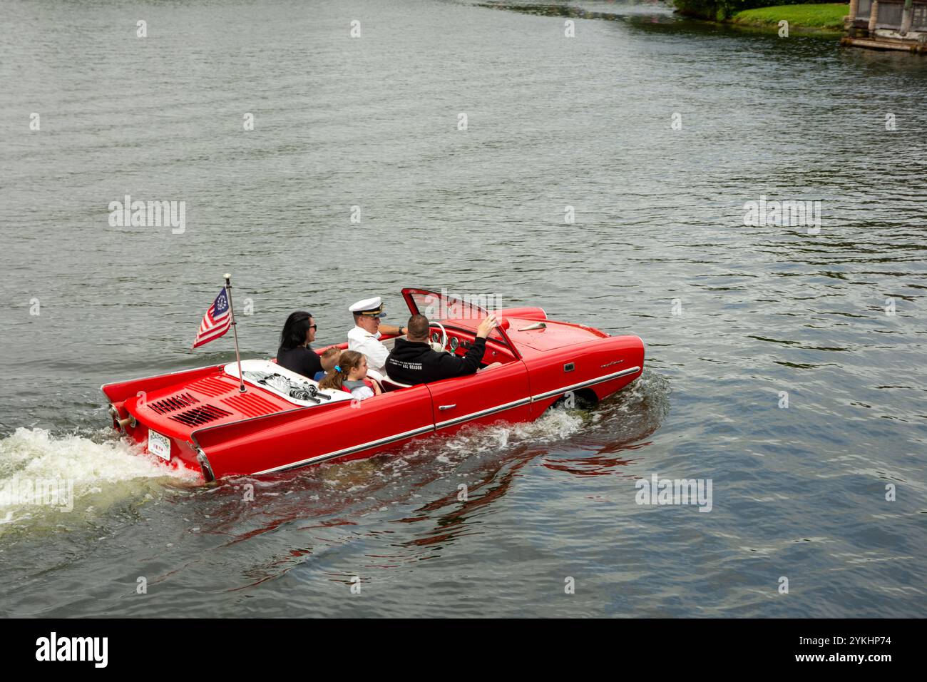 Amphibious vehicle transitioning from land to water, with passengers on ... Amphibious vehicle transitioning from land to water, with passengers on ...